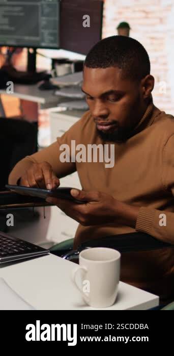 Vertical video Admin in wheelchair using tablet in innovative startup ...