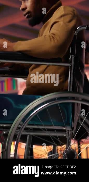 Vertical video Admin in wheelchair using tablet in innovative startup ...