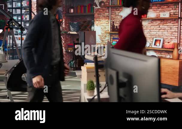 Irked man punching startup office desk in frustration struggling to fix ...