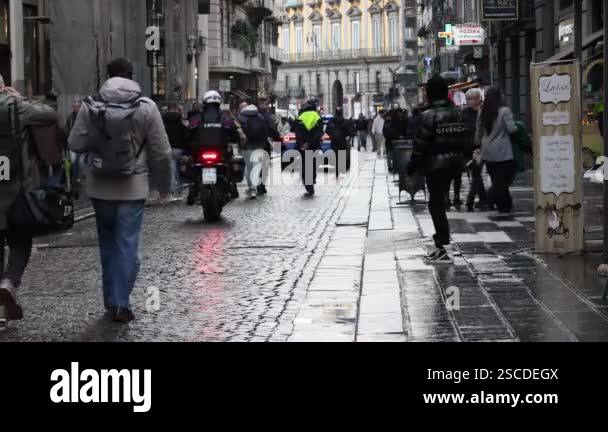 Naples, Italy - January 28, 2025: City life in the crowded via Toledo ...