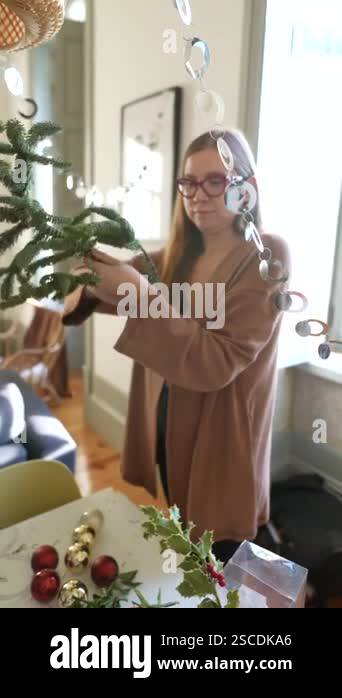 A delightful and joyful moment of decorating for the festive holidays ...