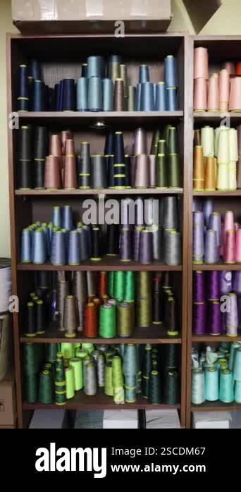 Colorful Array of Sewing Threads Shown Neatly Arranged on Shelves in ...