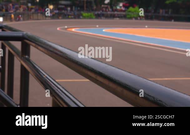 A close-up view of a black railing with a smooth finish, overlooking a ...