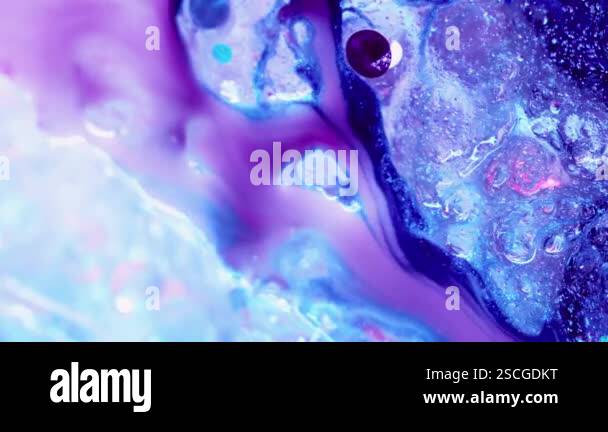 Violet fluid. Paint ice. Liquid purple watercolor flows on frozen blue ...