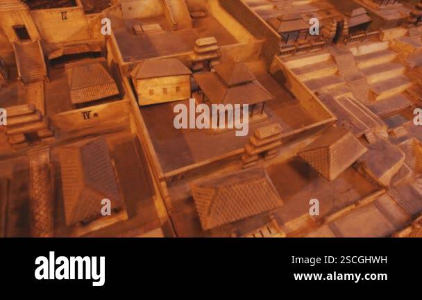 A detailed model of an ancient city layout, showcasing various ...
