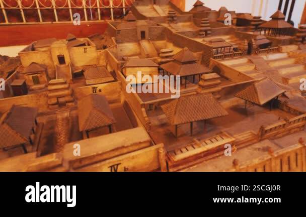 A detailed model of an ancient city, showcasing various buildings with ...