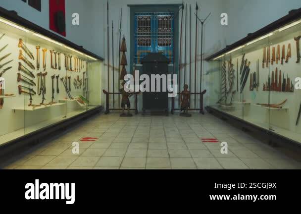 An interior view of a museum showcasing traditional weapons and ...