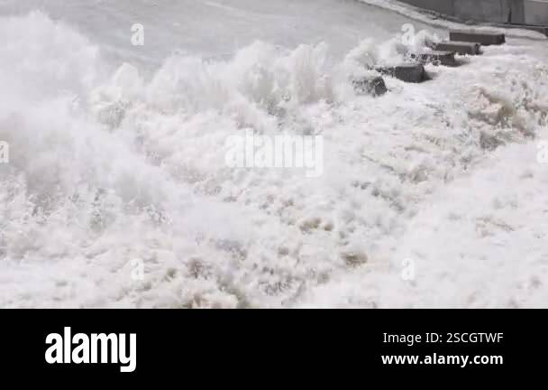 row of chute dentate blocks in concrete water spillway channel slope ...