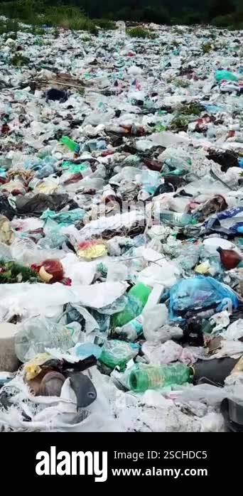 A vast area covered in plastic waste, illustrating severe environmental ...
