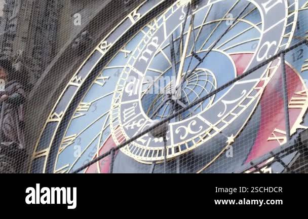 A detailed closeup view of an ornate astronomical clock face that ...
