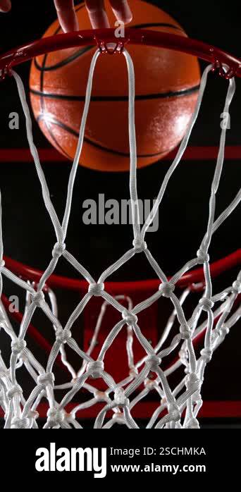 Super Slow Motion of Basketball Ball Hitting the Basket. Filmed on High ...