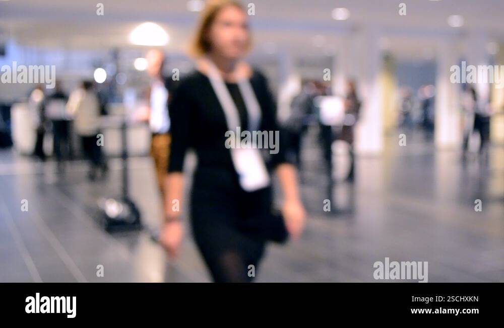 People stand behind the racks in a volume of white empty room Stock ...