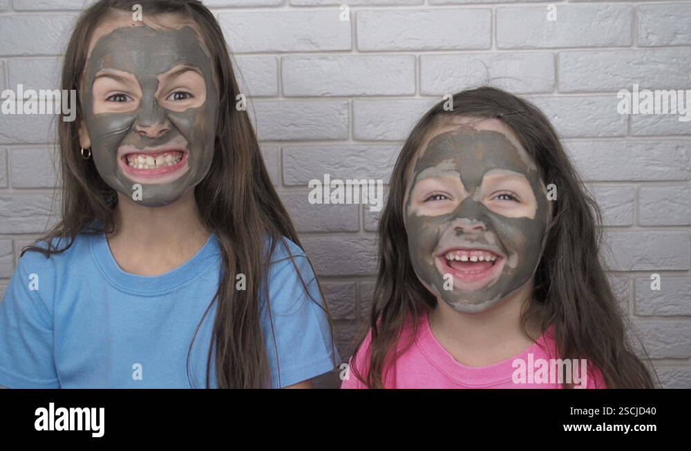 Funny children in a clay mask Stock Video Footage - Alamy