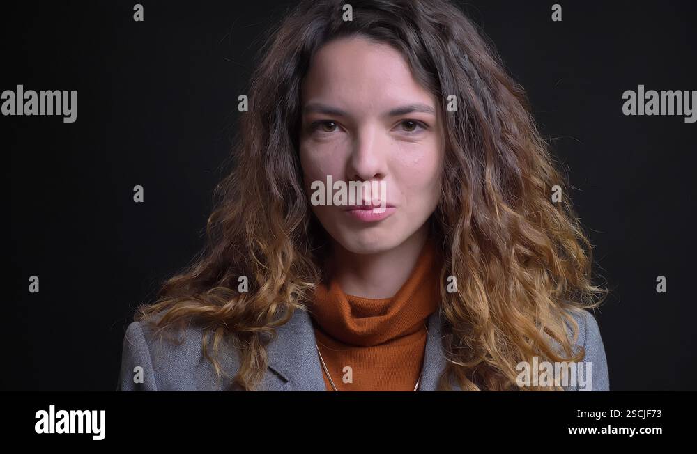 Closeup portrait of adorable brunette female playing a fool while ...