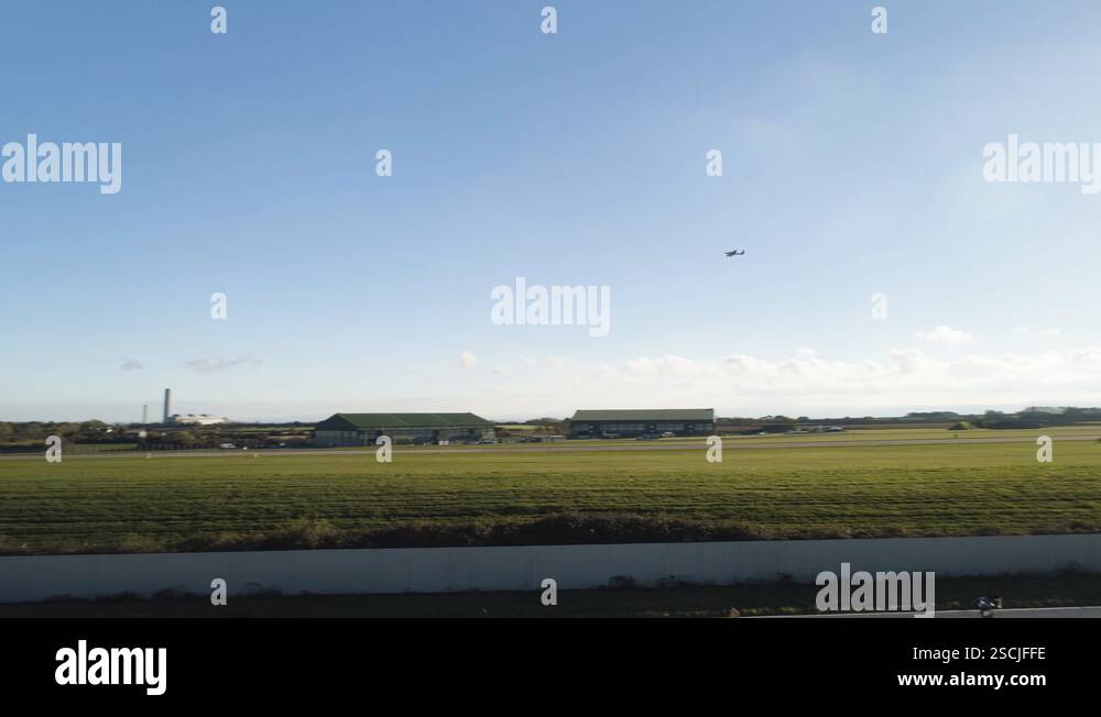 Small aeroplane tacking off from airport. Plane climbs into sky, drone ...