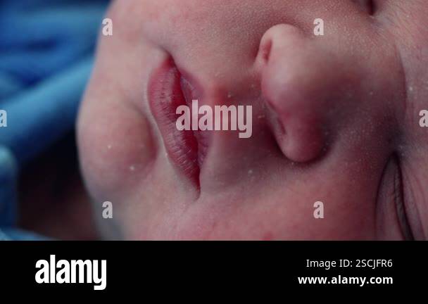 Sleeping Newborn baby infant's mouth and face in macro detail during ...