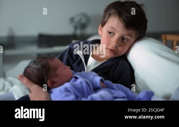 Boy Greeting Newborn Brother in Hospital - Celebratory First Day of ...