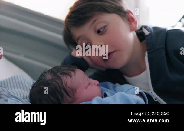 Heartwarming Family Moment - Young Boy Giving Eskimo Kiss to Newborn ...