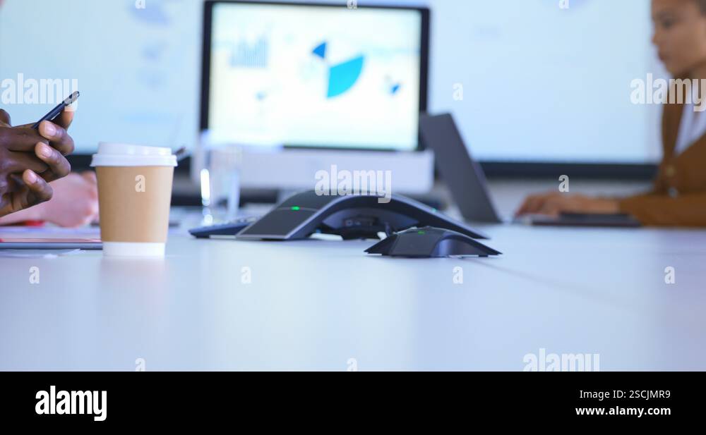 Mid section of male executive using mobile phone in modern office 4k ...