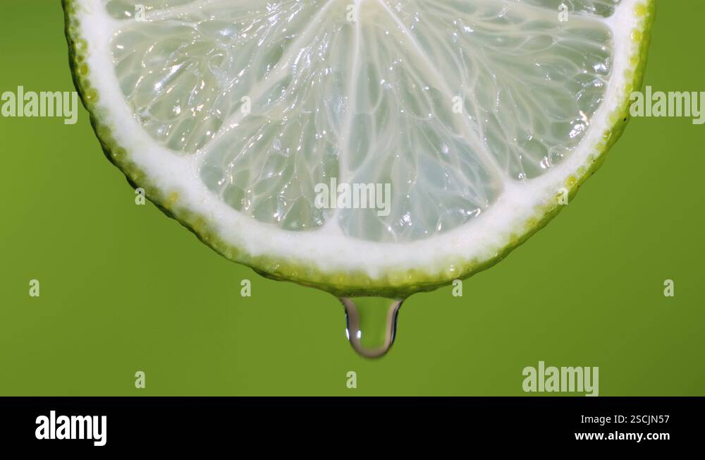 Fresh slice lime, a drop of water falls. The fruit gives off freshness and juice Stock Video ...