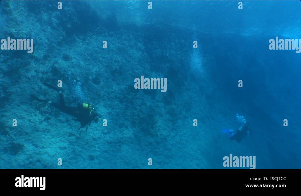 wall dive scenery scuba divers sky background underwater Stock Video ...