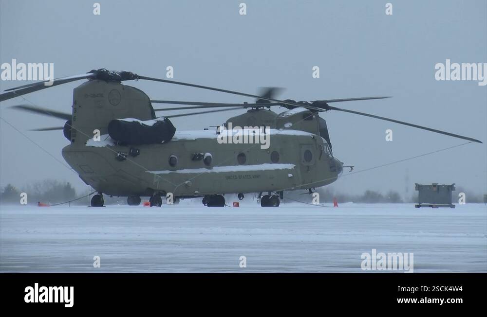 CH-47 Chinook ground running on snow covered runway Stock Video Footage ...
