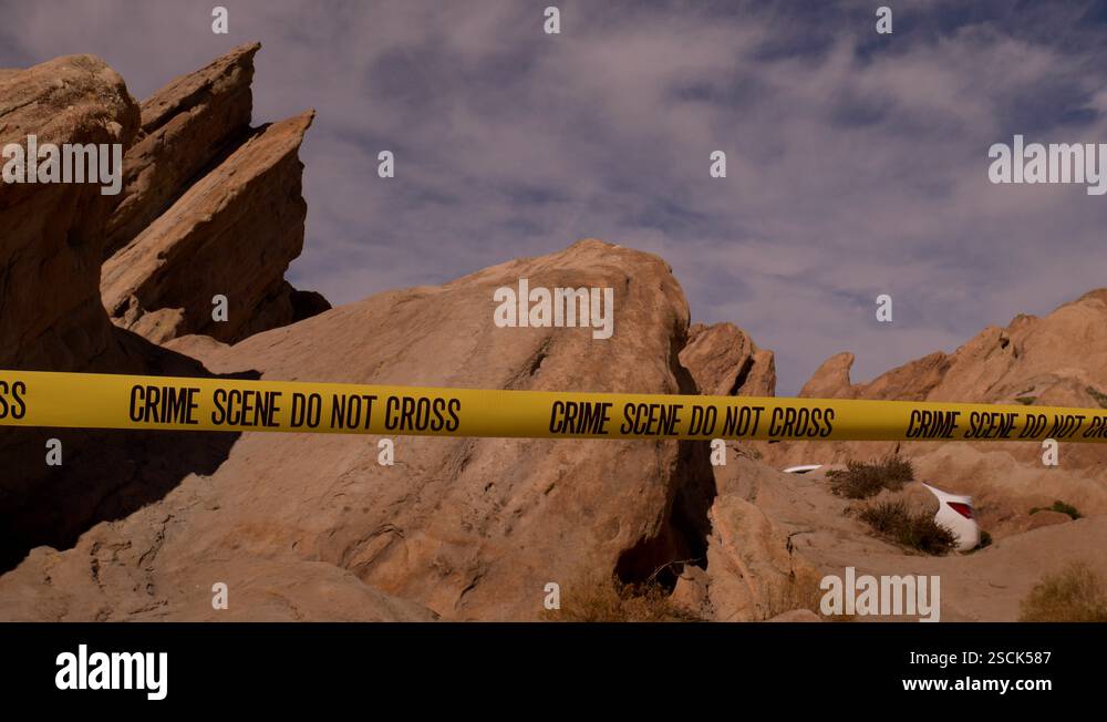 DESERT CRIME SCENE WITH CAR IN BACKGROUND. SLIDER SHOT IN 4K, 10 BIT ...