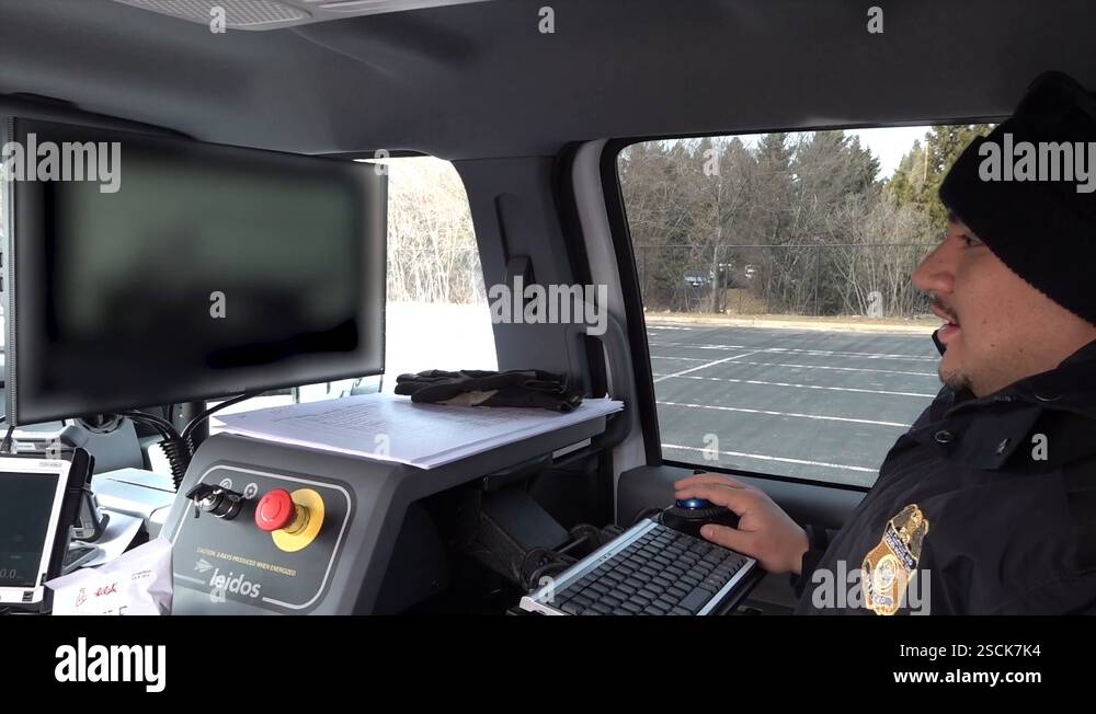 Customs officer operating x-ray machine scanning vehicles at Super Bowl ...