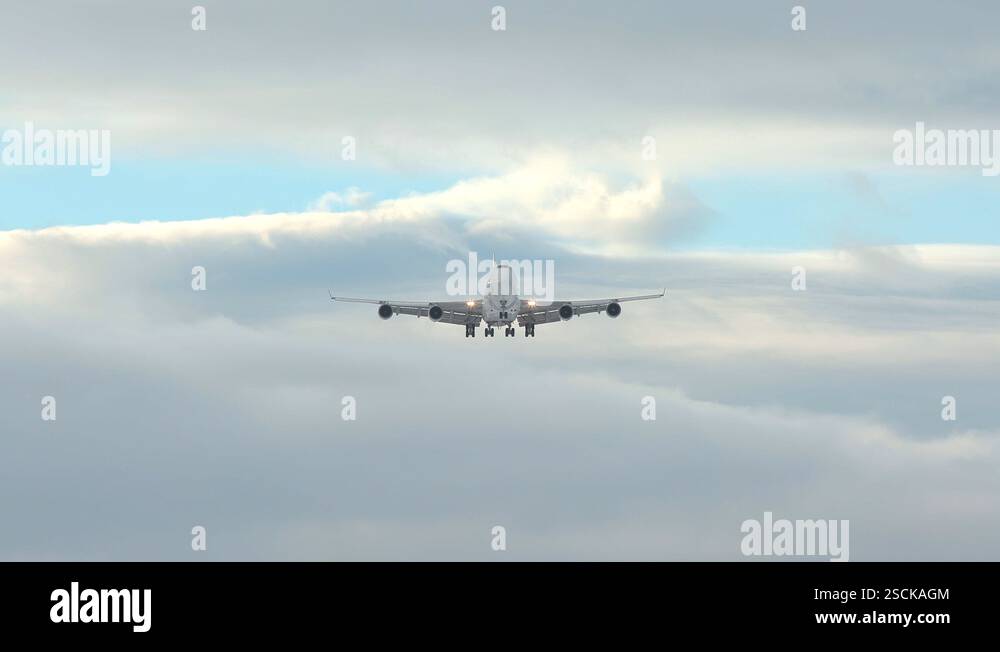 huge airplane jumbojet boeing 747 in flight passing overhead slow ...