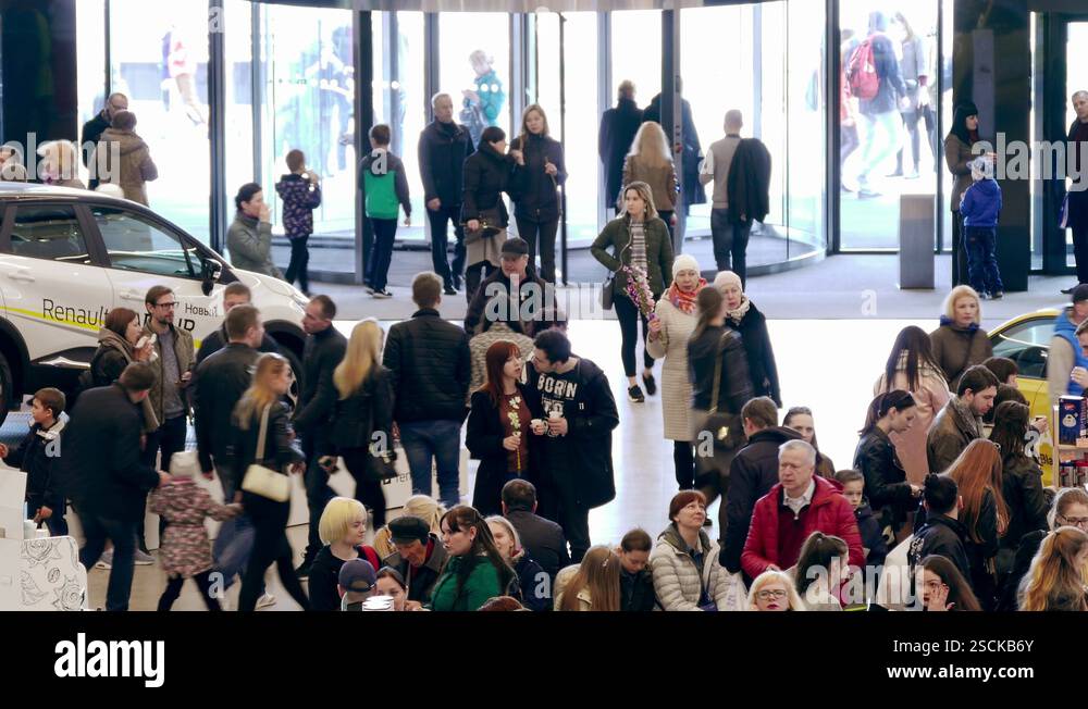 Visitors in Spring Clothes Enter and Exit Shopping Center Doors Stock ...