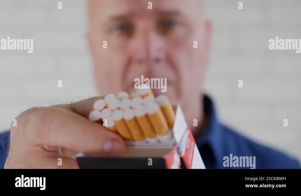 Man Smoking a Cigarette Offers to Another Smoker a Cigarette from a New ...