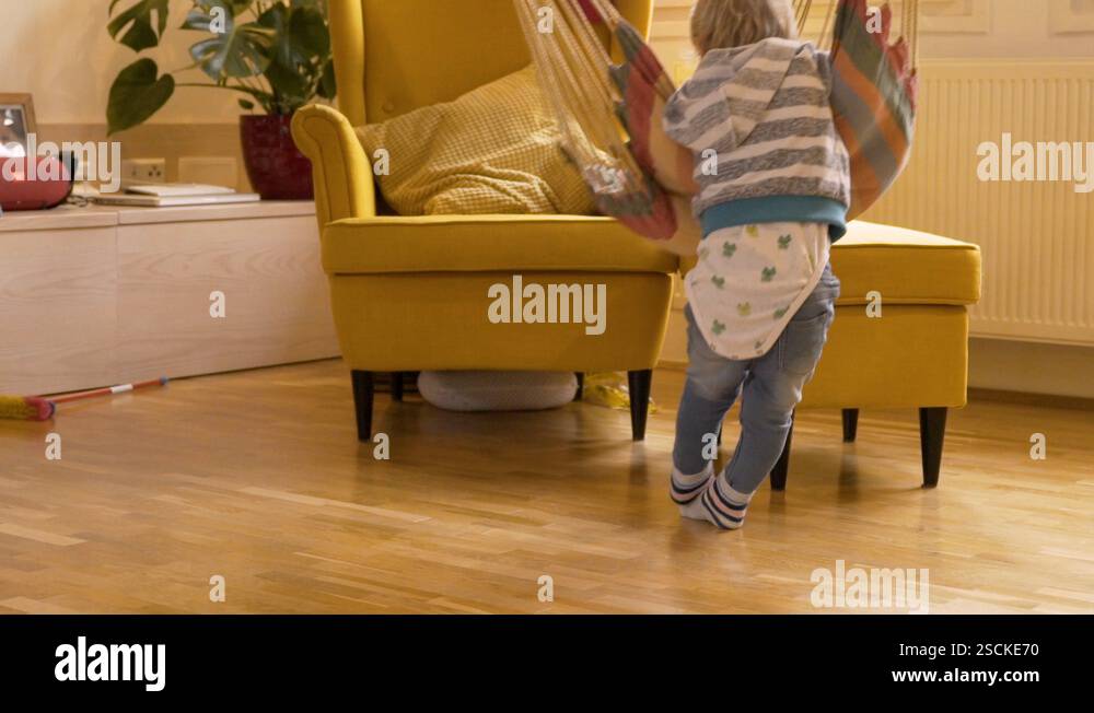 Adorable infant boy rotating at cushioned single swing Stock Video ...