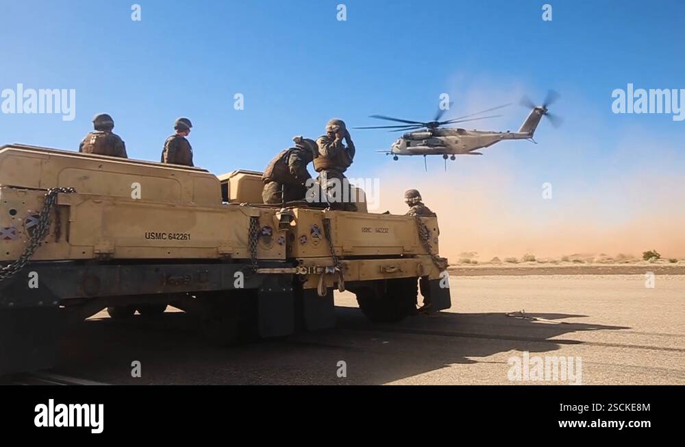 CH-53 Super Stallion approaching soldiers for sling load operations ...