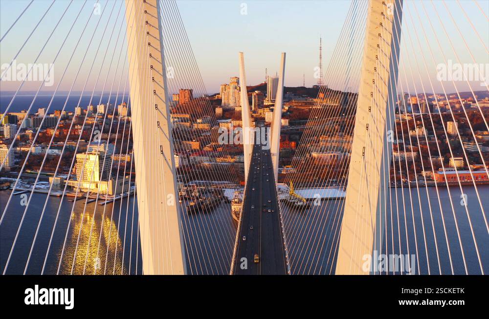Flying between Golden Bridge pillars, aerial view of bridge road with ...