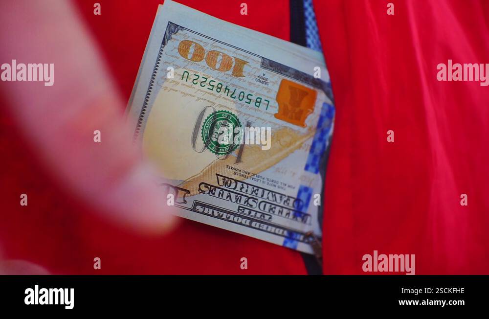 hand folds into pocket paper hundred dollar bills.closeup Stock Video ...