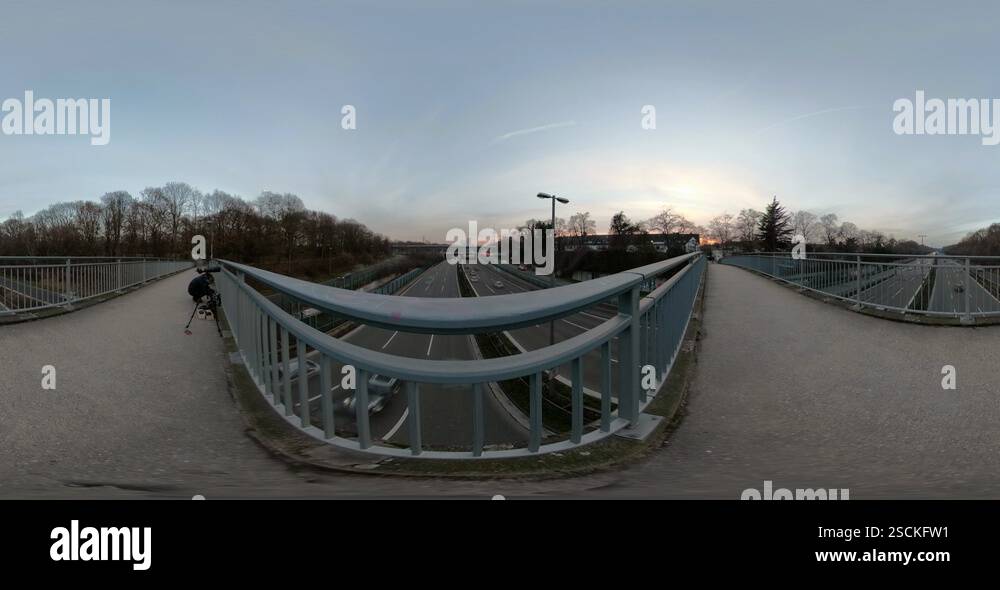 360 VR Timelapse of man on highway bridge taking pictures of urban city ...