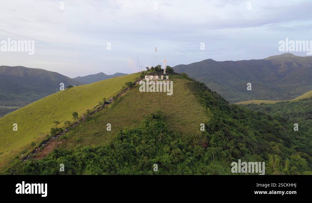 Amazing aerial of Coron hill peak showing Sign, Cross and steps 4K ...