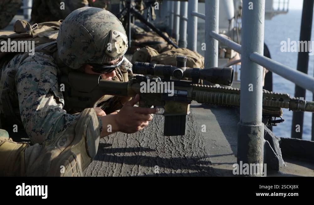 U.S. Marine firing rifle from deck of USS Wasp LHD1 Stock Video Footage ...