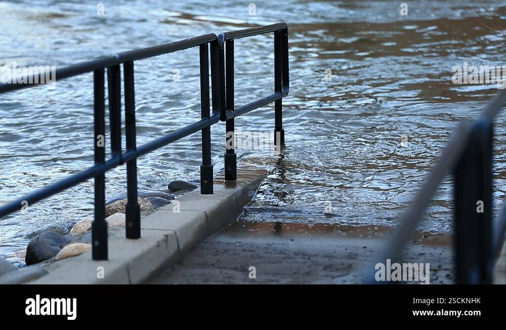 Flood Waters Overtake Walkway with Railing - Shallow Depth of Field ...