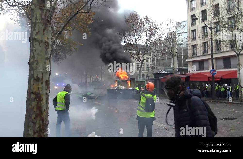 Heavy fire and dark smoke billowing from debris during riot in Europe ...