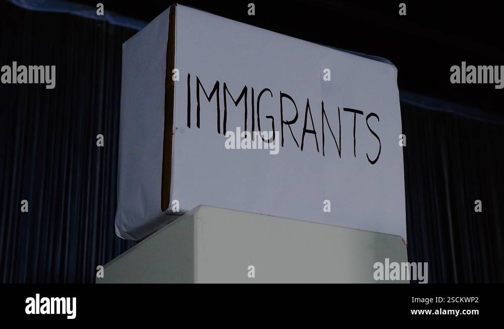 Immigrants Labeled Box on Stand Stock Video Footage - Alamy