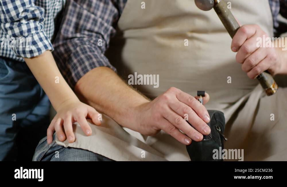Shoemaker Teaching Little Son How to Replace Heel Tips Stock Video ...