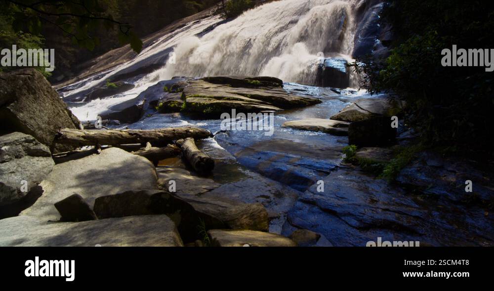 Idyllic waterfall flowing from the rock mountain in slow motion Stock ...