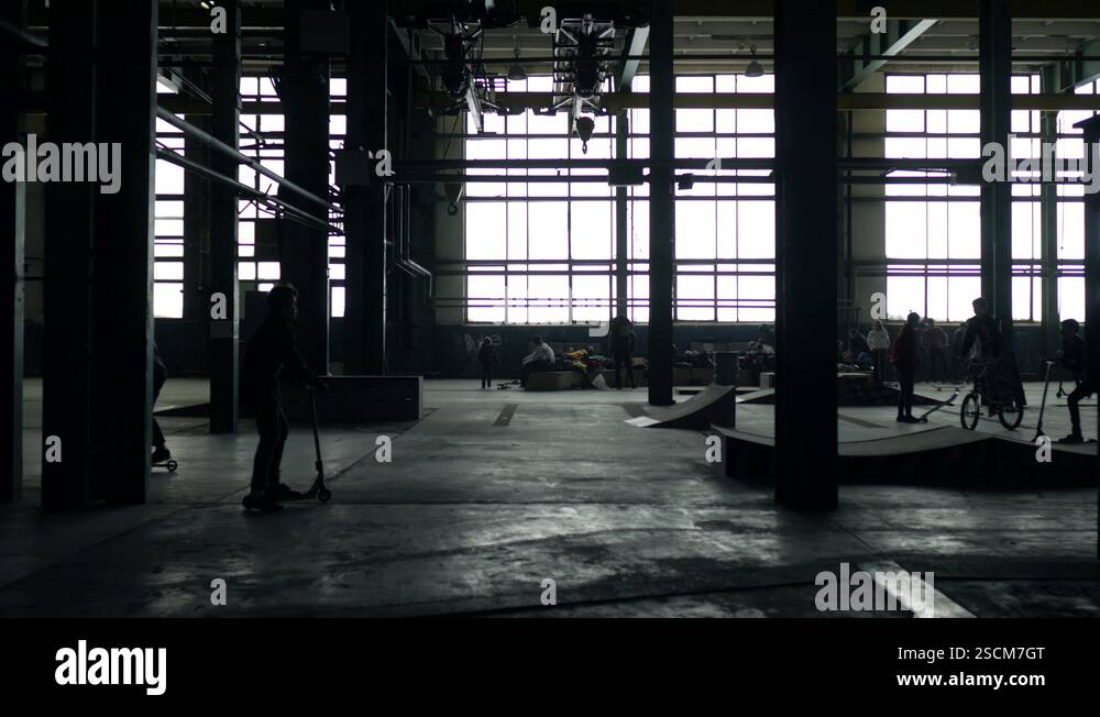skate park in a dark old hangar building Stock Video Footage - Alamy
