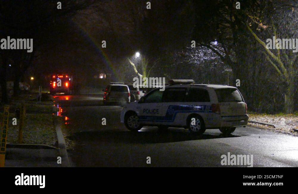 Tactical cops seen in the distance walking towards a house in aligned ...