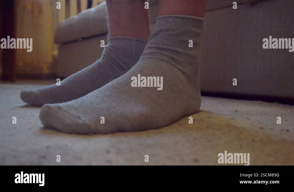 hand removed the socks off his feet.close-up.low point of shooting ...