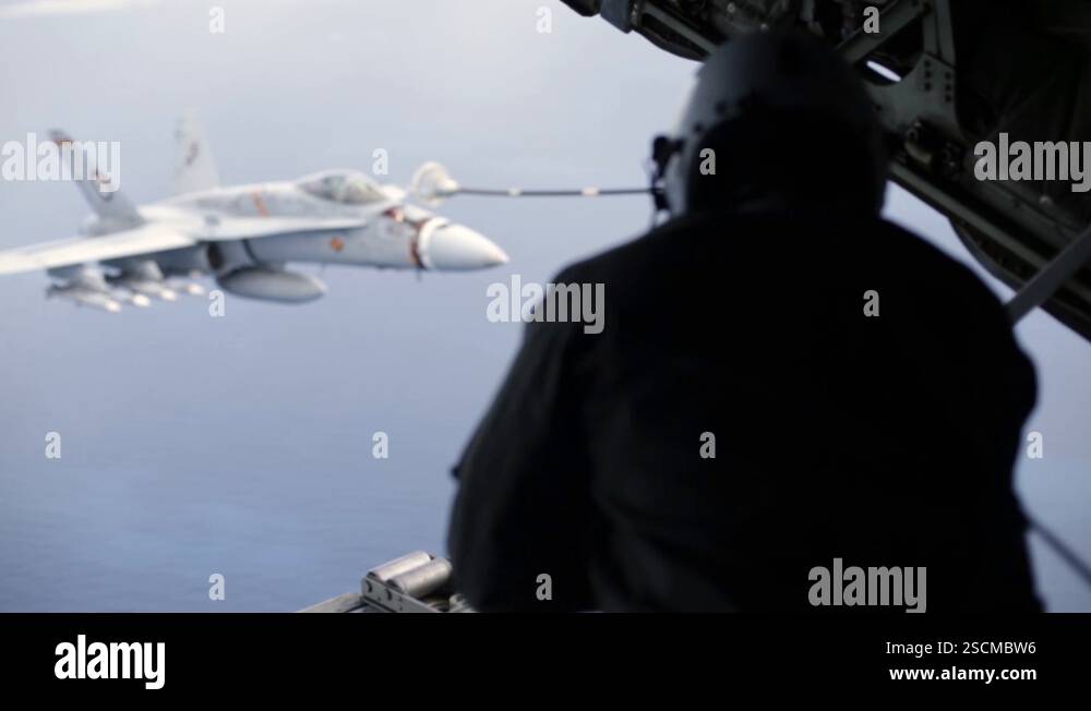 F/A-18 Hornet conducts aerial refuel with probe and drogue Stock Video ...