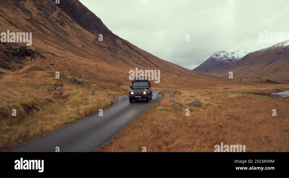 Land Rover Defender adventuring across Glen Etive valley drone aerial ...