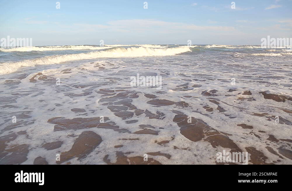Movement of the camera over the waves. Wave comes close to the shore ...