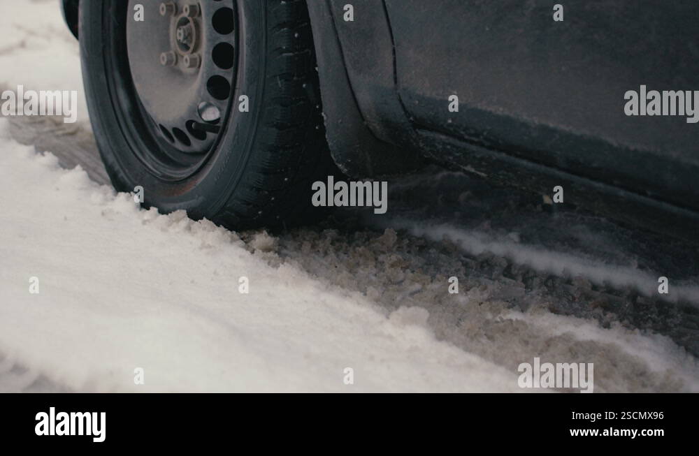 Passenger car stuck in a snowdrift. Wheel slip Close-up Stock Video ...